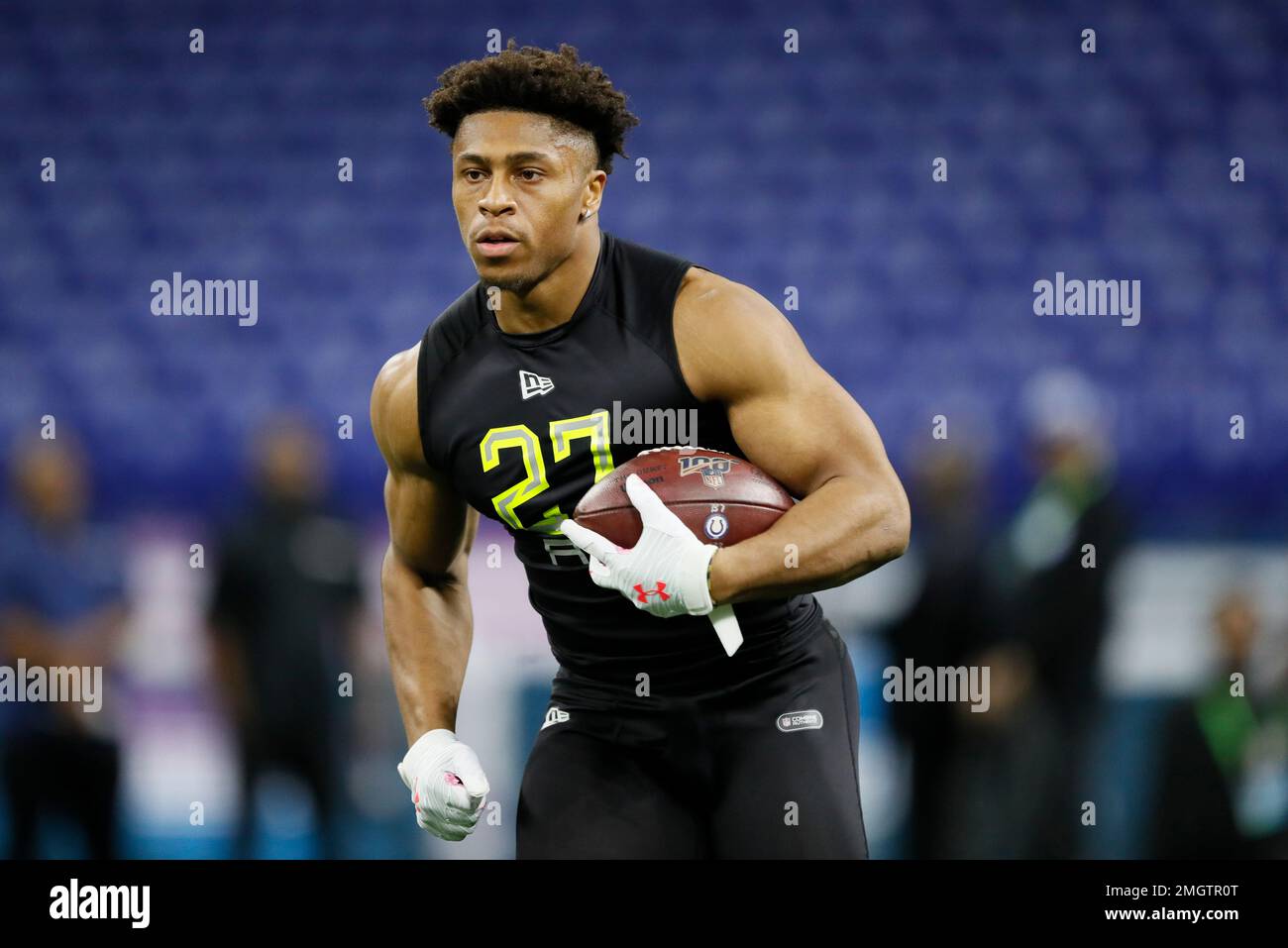 Wisconsin running back Jonathan Taylor runs a drill at the NFL football ...