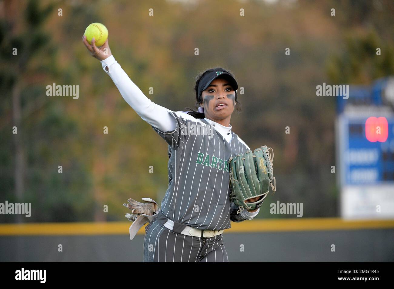 Dartmouth's Morgan Ebow throws in the outfield after an NCAA softball ...
