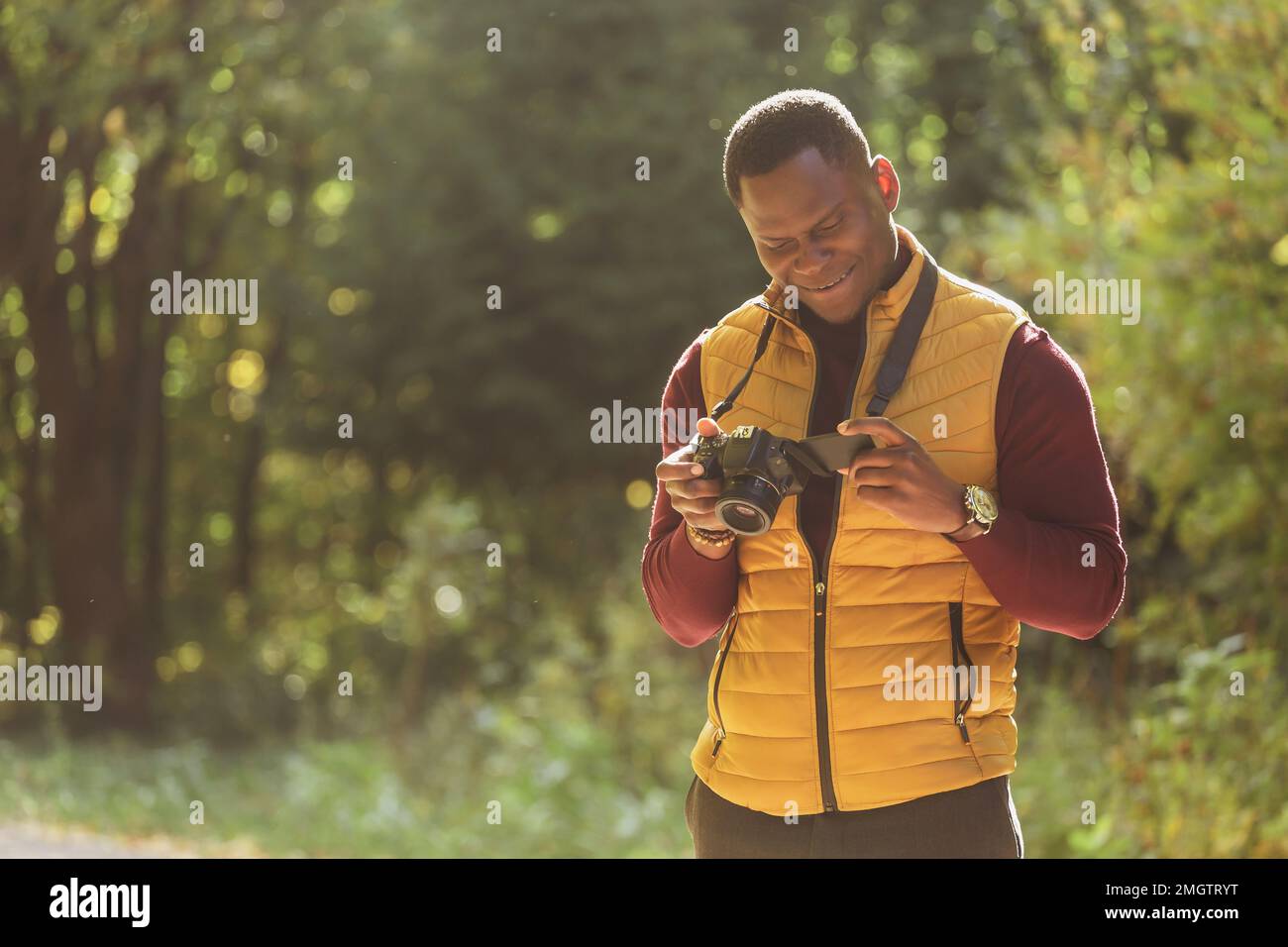 African american guy photographer taking picture with photo camera on ...
