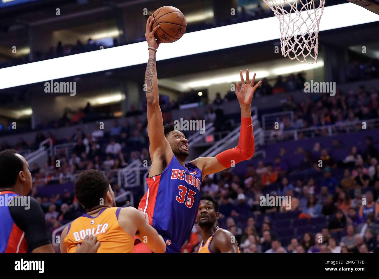 Detroit Pistons forward Christian Wood (35) dunks over Phoenix Suns ...