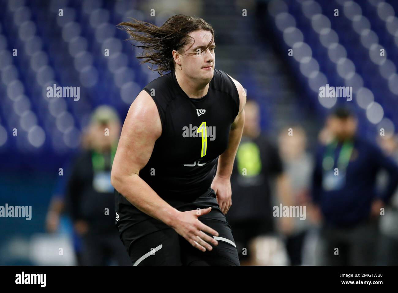 Washington offensive lineman Trey Adams runs a drill at the NFL ...
