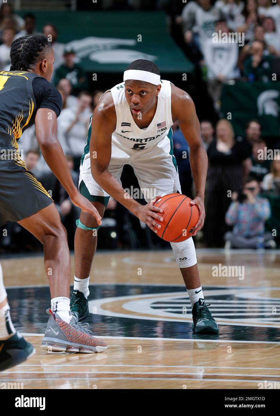 Michigan State's Cassius Winston looks to drive against Iowa during the ...