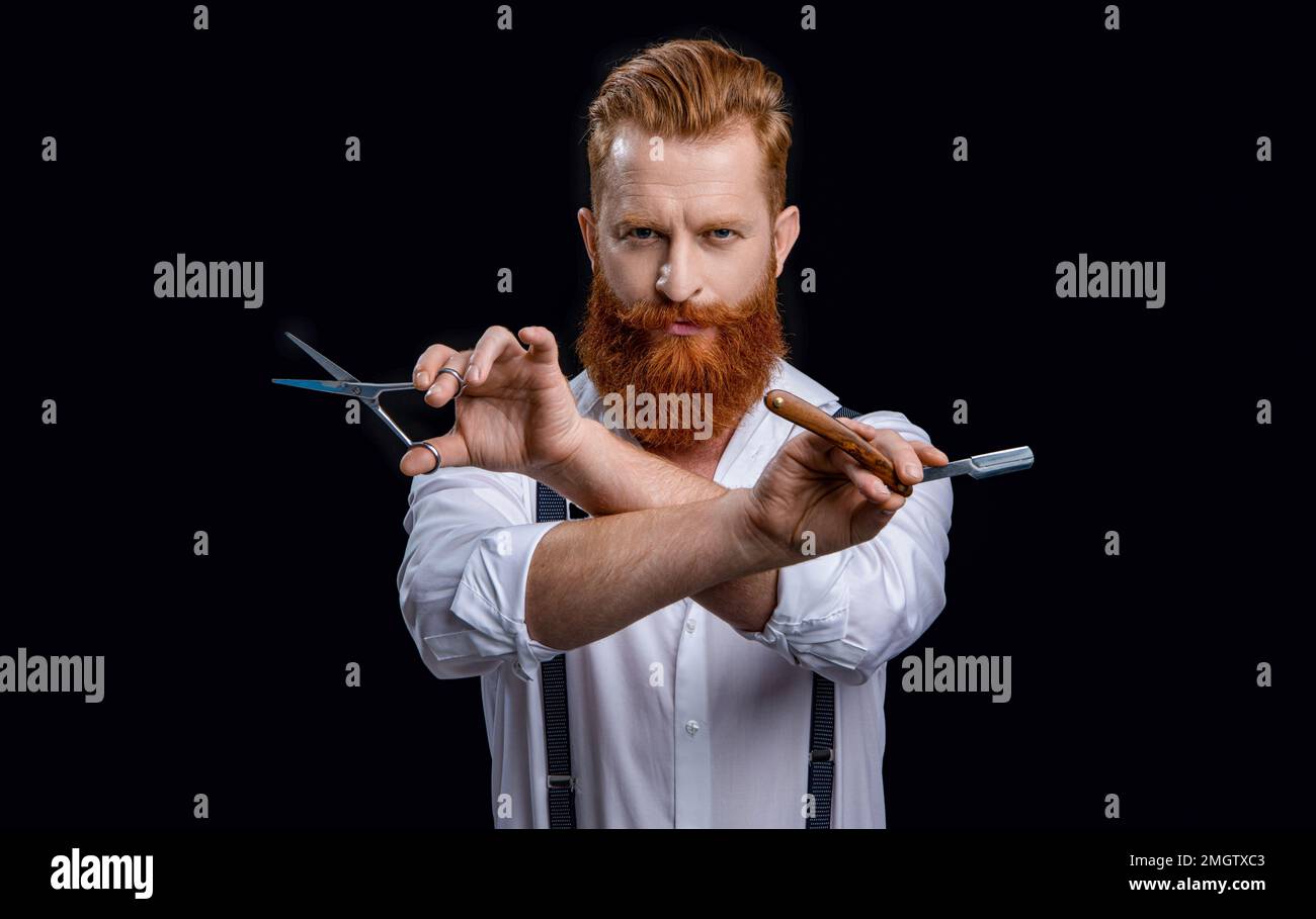 hairdresser man with scissors and retro razor blade. photo of ...