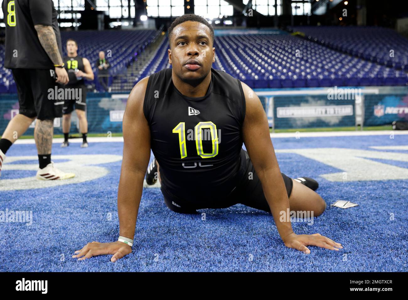 Charlotte offensive lineman Cameron Clark stretches at the NFL football ...
