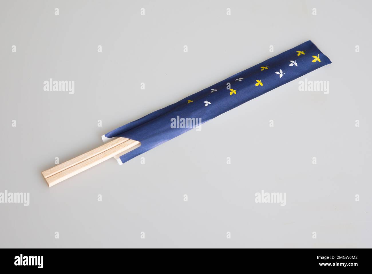 Chinese wooden chopsticks in blue paper packaging Stock Photo - Alamy
