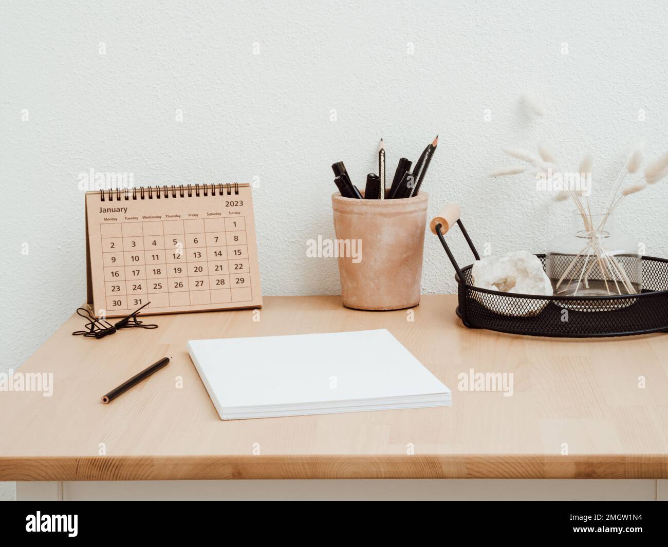 Home office wood desk with home decor various accessories. Front view ...