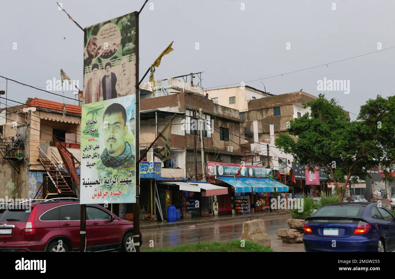 Posters of Hezbollah leaders and martyrs is seen in the suburbs of ...