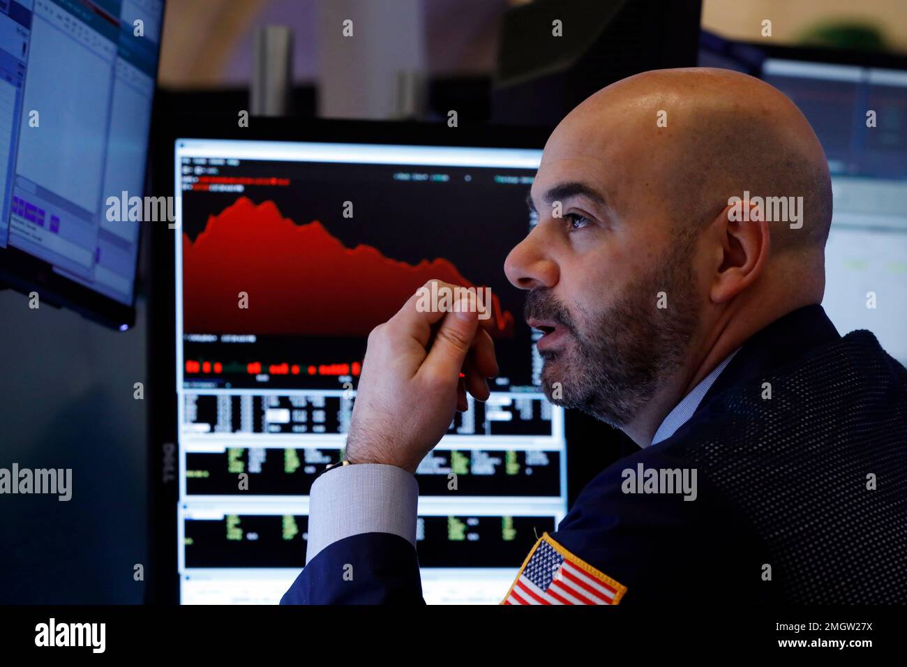 Trader Fred DeMarco works on the floor of the New York Stock Exchange ...