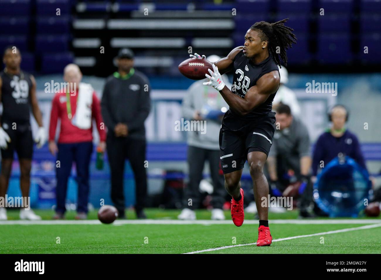 Miami wide receiver K J Osborn runs a drill at the NFL football ...