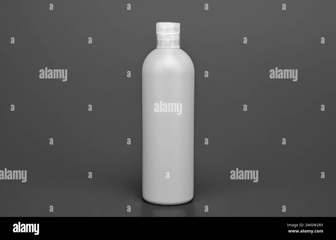 orange shampoo bottle on blue background, cosmetology Stock Photo - Alamy