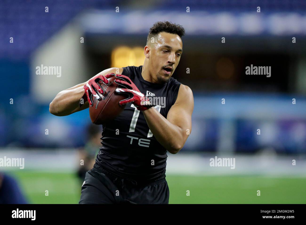 Arkansas tight end C J O'Grady runs a drill at the NFL football ...