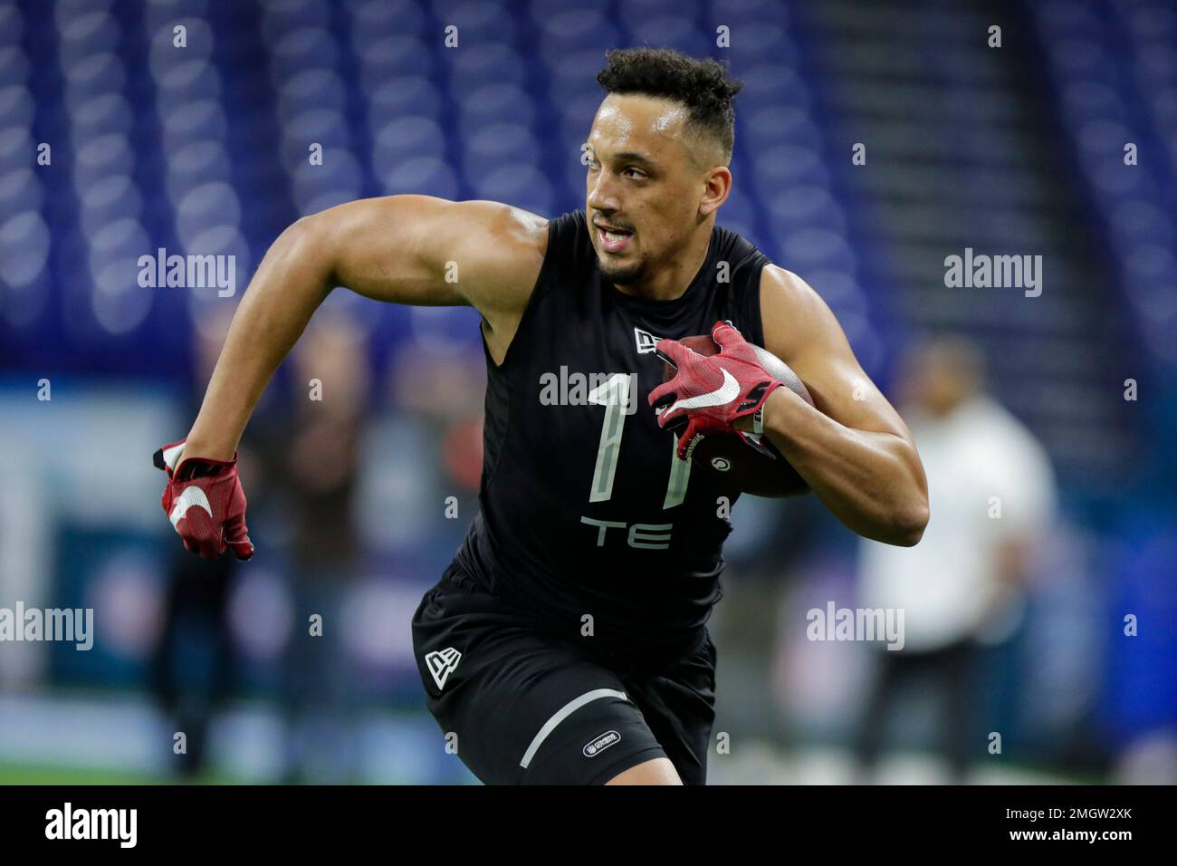 Arkansas tight end C J O'Grady runs a drill at the NFL football ...