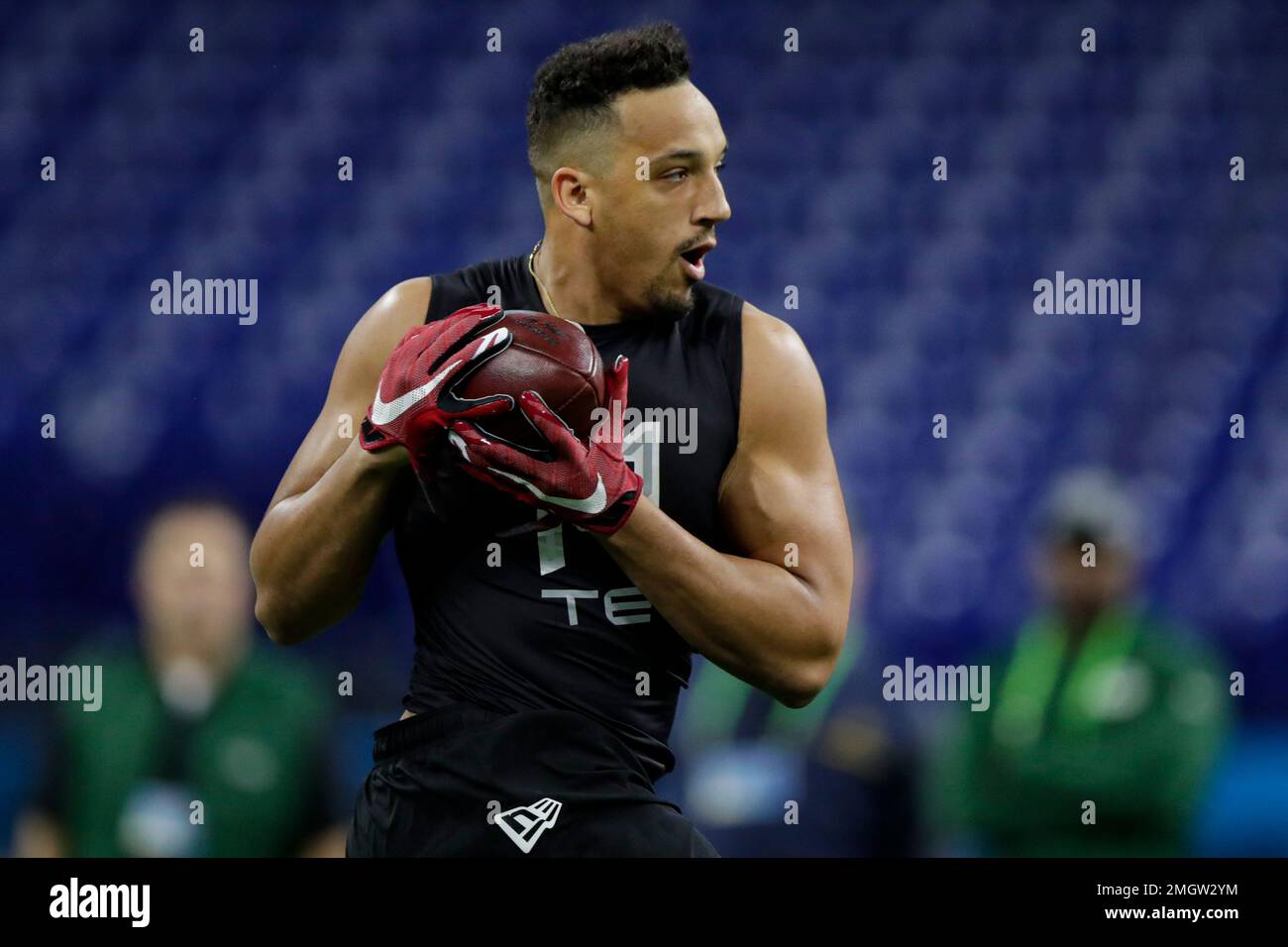 Arkansas tight end C J O'Grady runs a drill at the NFL football ...
