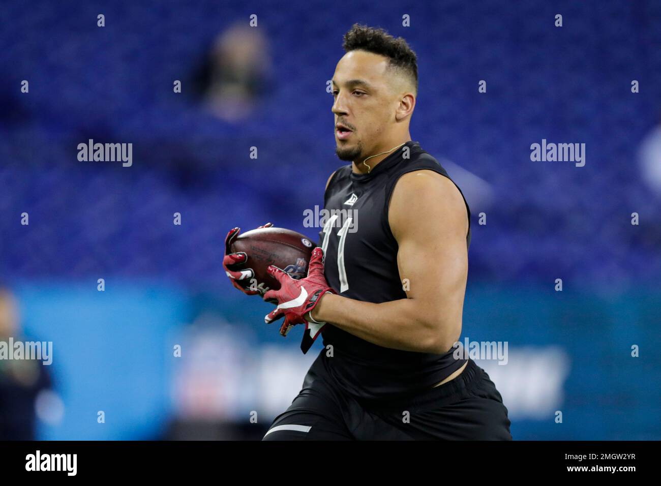 Arkansas tight end C J O'Grady runs a drill at the NFL football ...