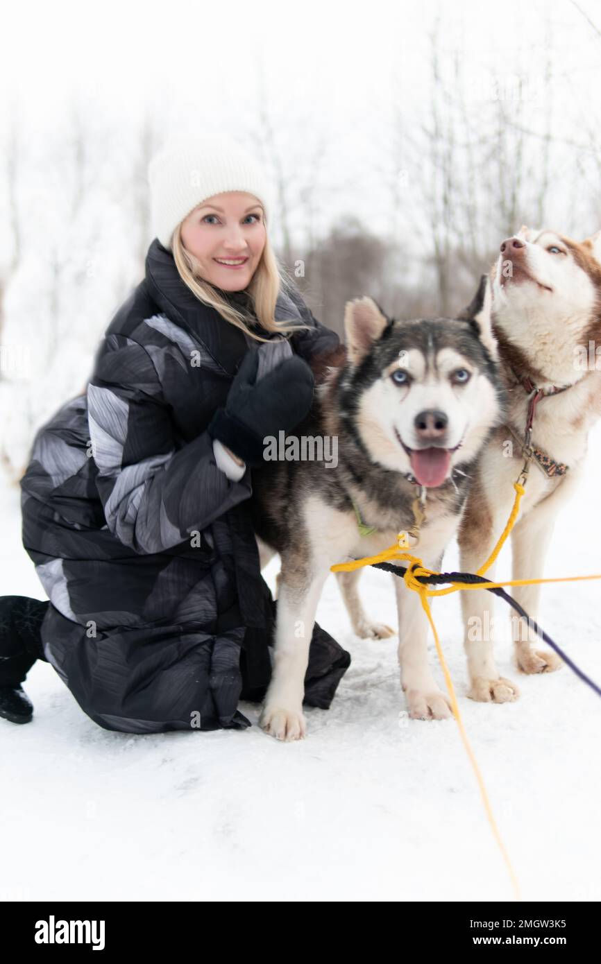 park pet young outdoor snow dog person girl animal husky season ...