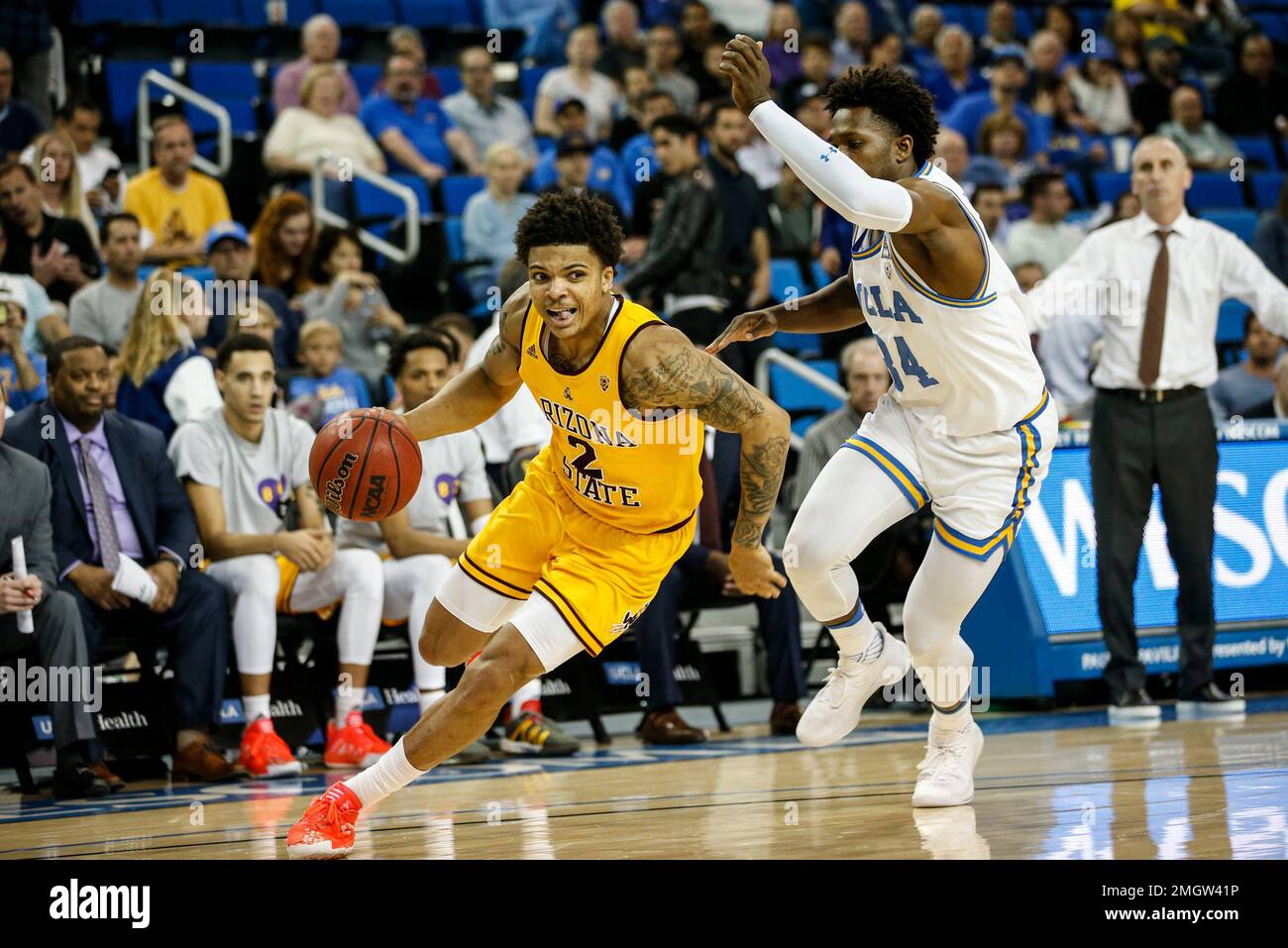 Arizona State guard Rob Edwards (2) drives past UCLA guard David ...