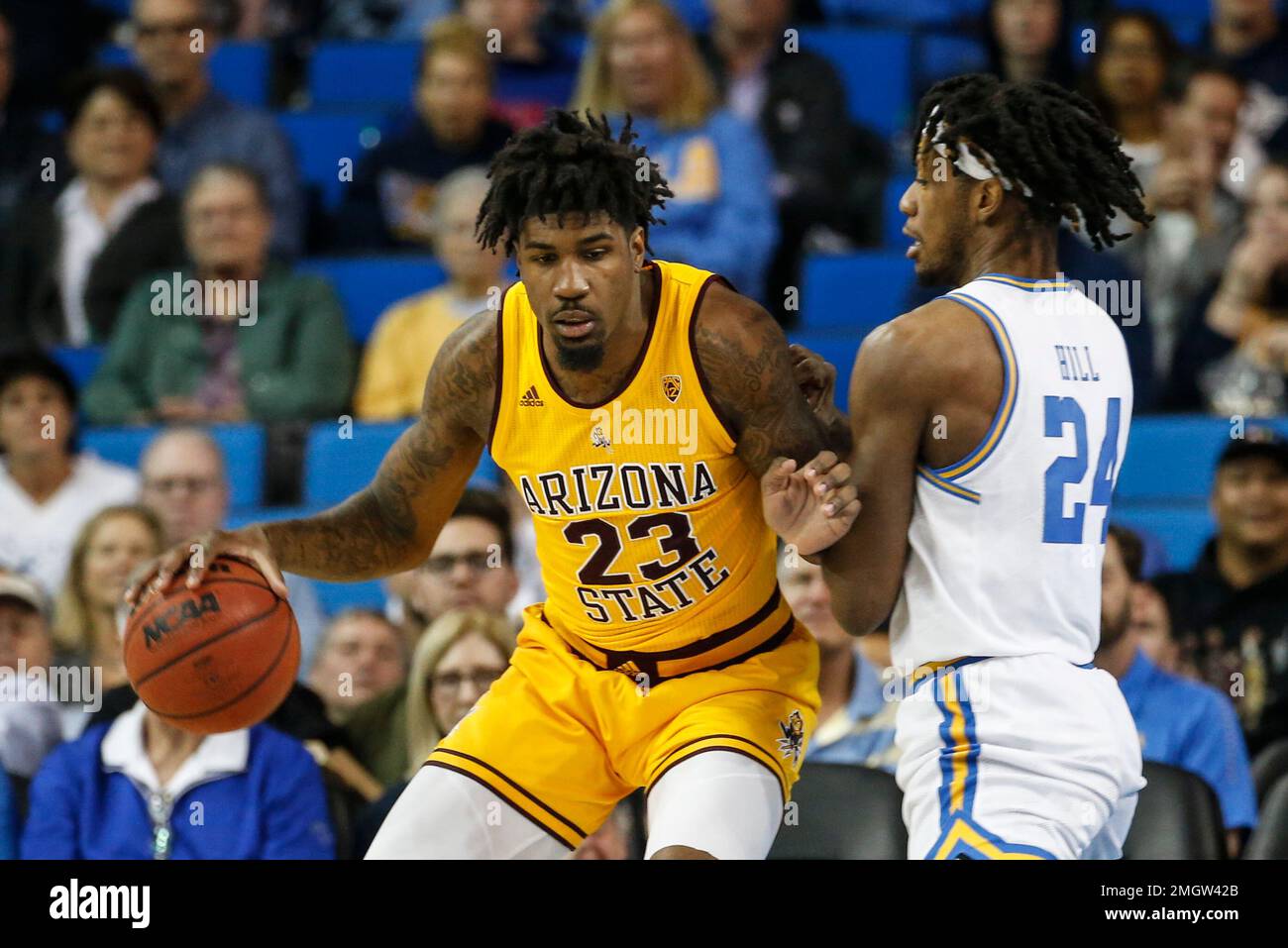 Arizona State forward Romello White (23) is defended by UCLA forward ...