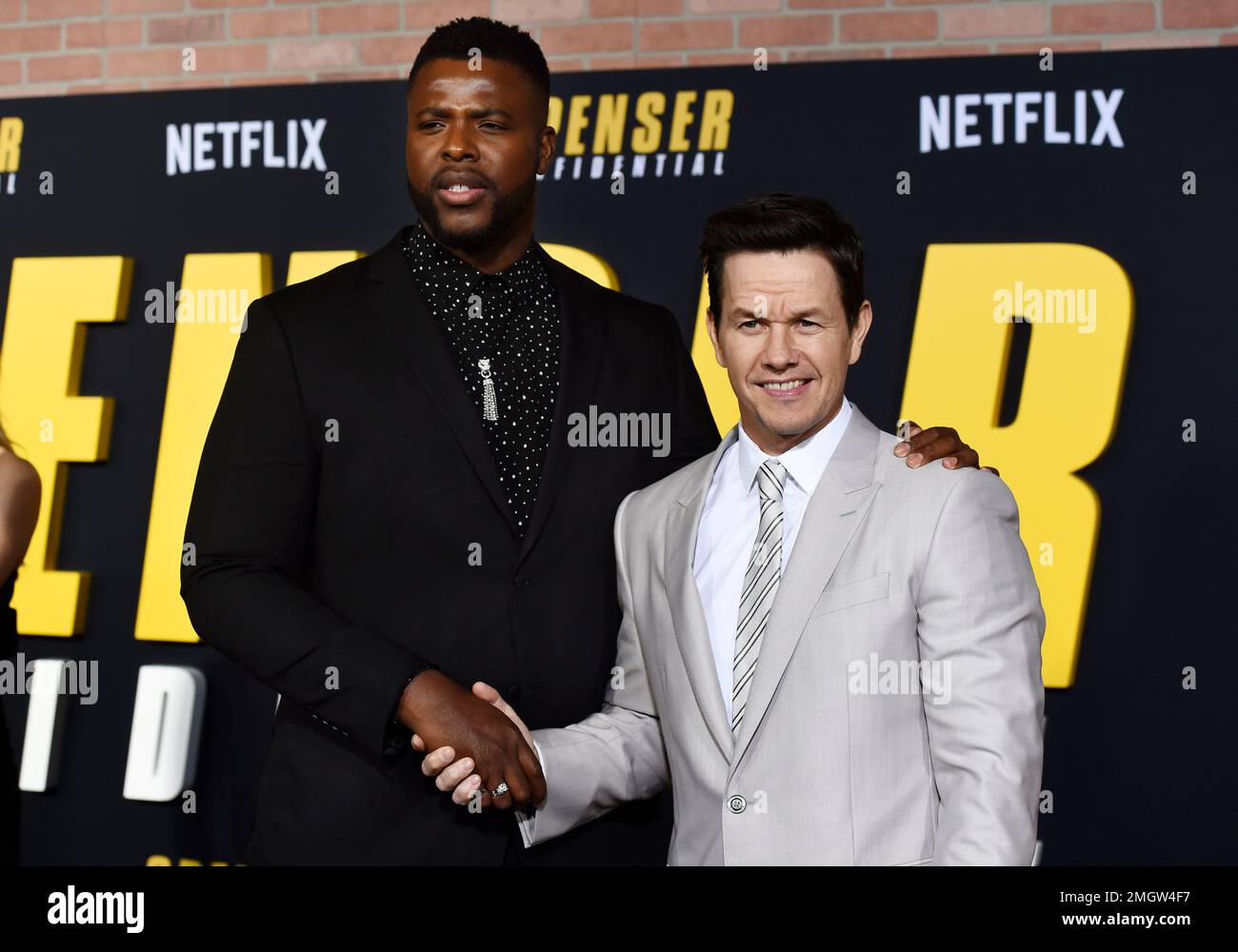 Winston Duke, left, and Mark Wahlberg, cast members in the Netflix film ...