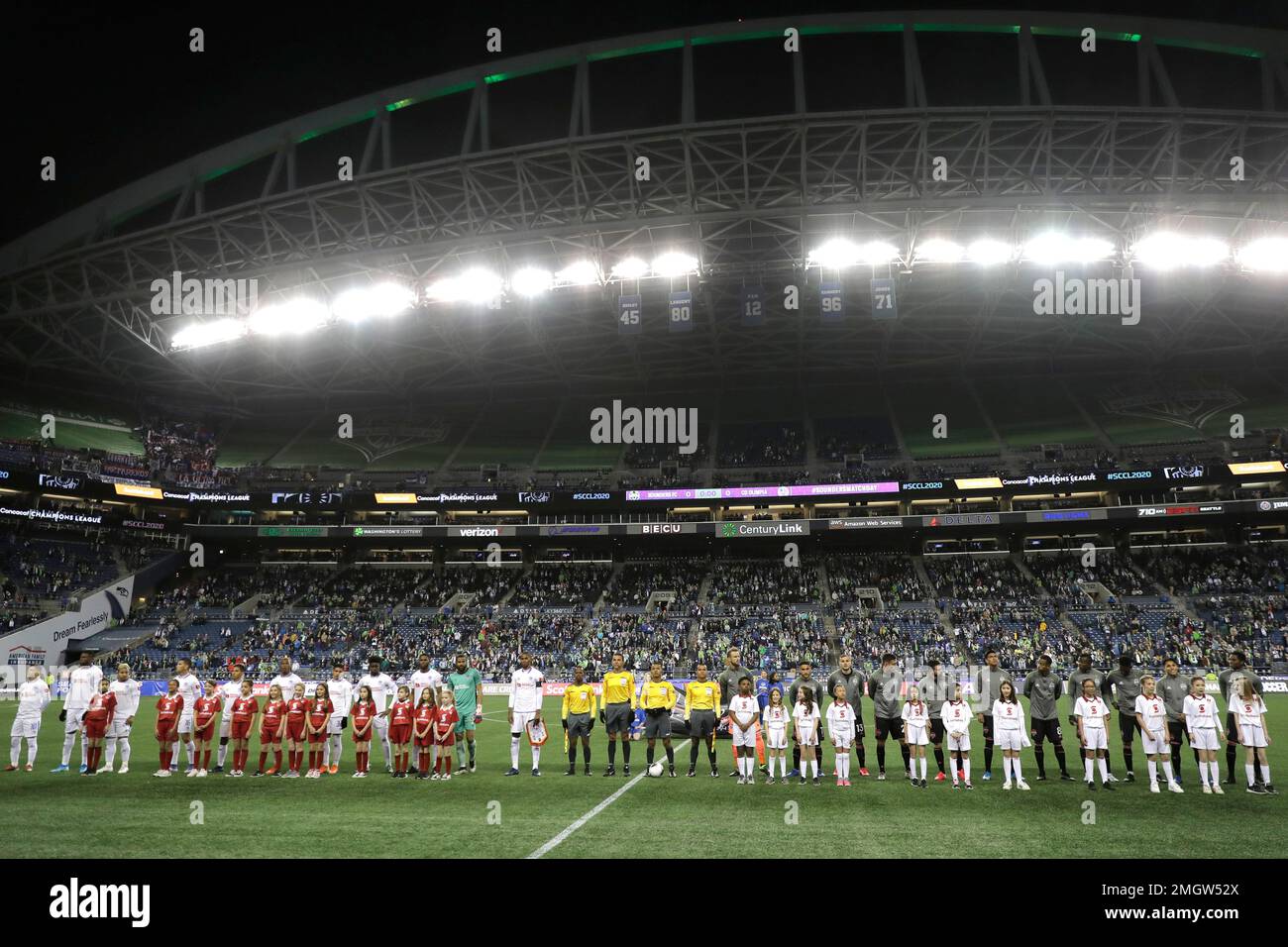 Seattle Sounders and Olimpia players line up with officials at the ...