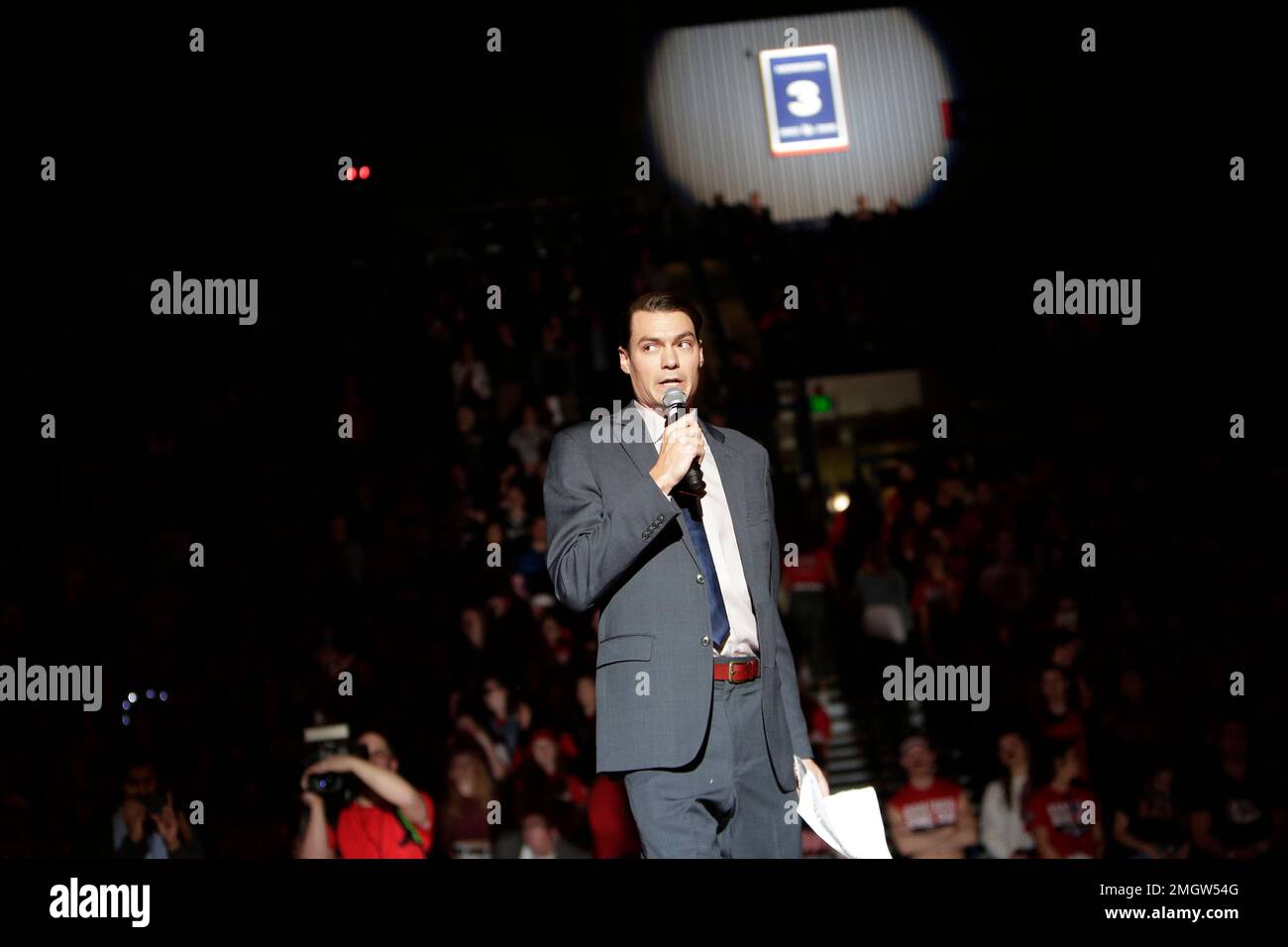 Former NBA and Gonzaga player Adam Morrison speaks under a banner with ...