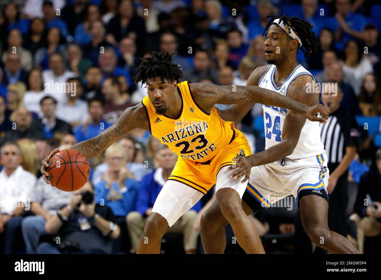 Arizona State forward Romello White (23) is defended by UCLA forward ...