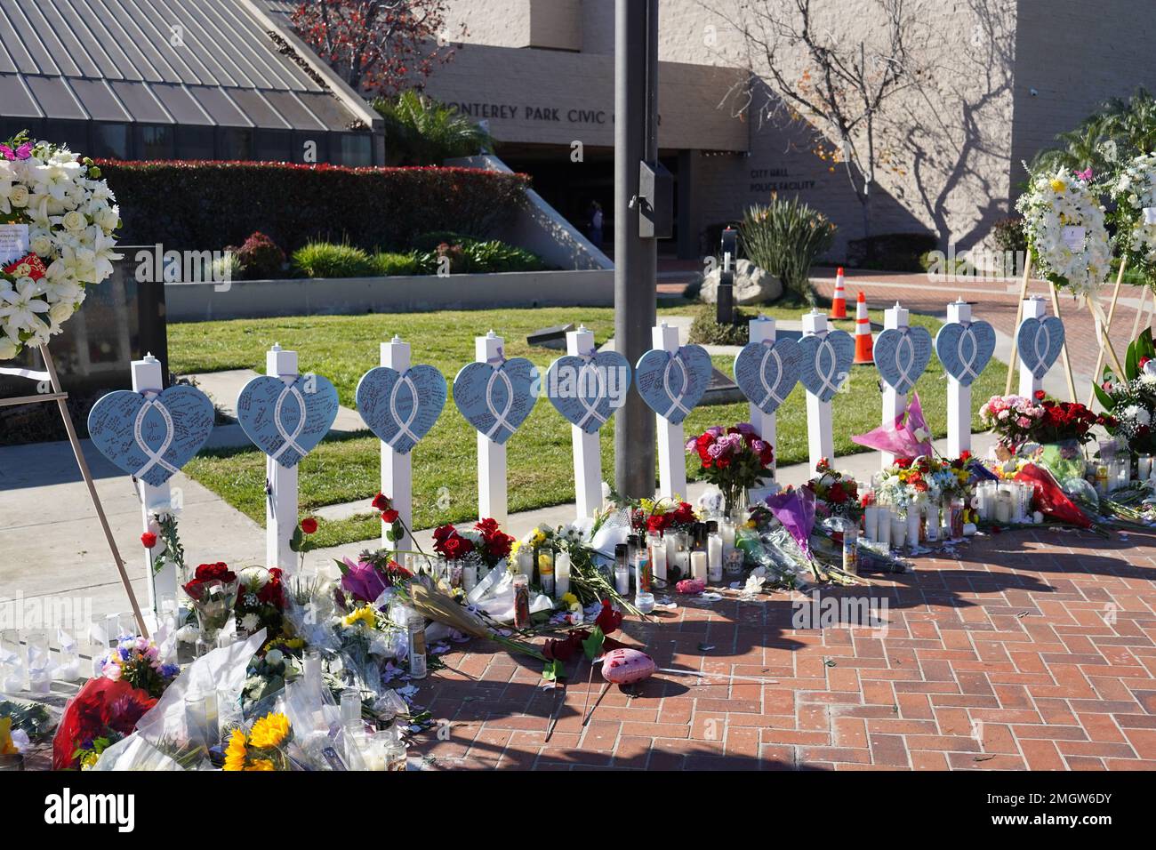 Wooden hearts with the names of mass shooting victims Valentino Marcos Alvero, Hongying Jian, Yu ...
