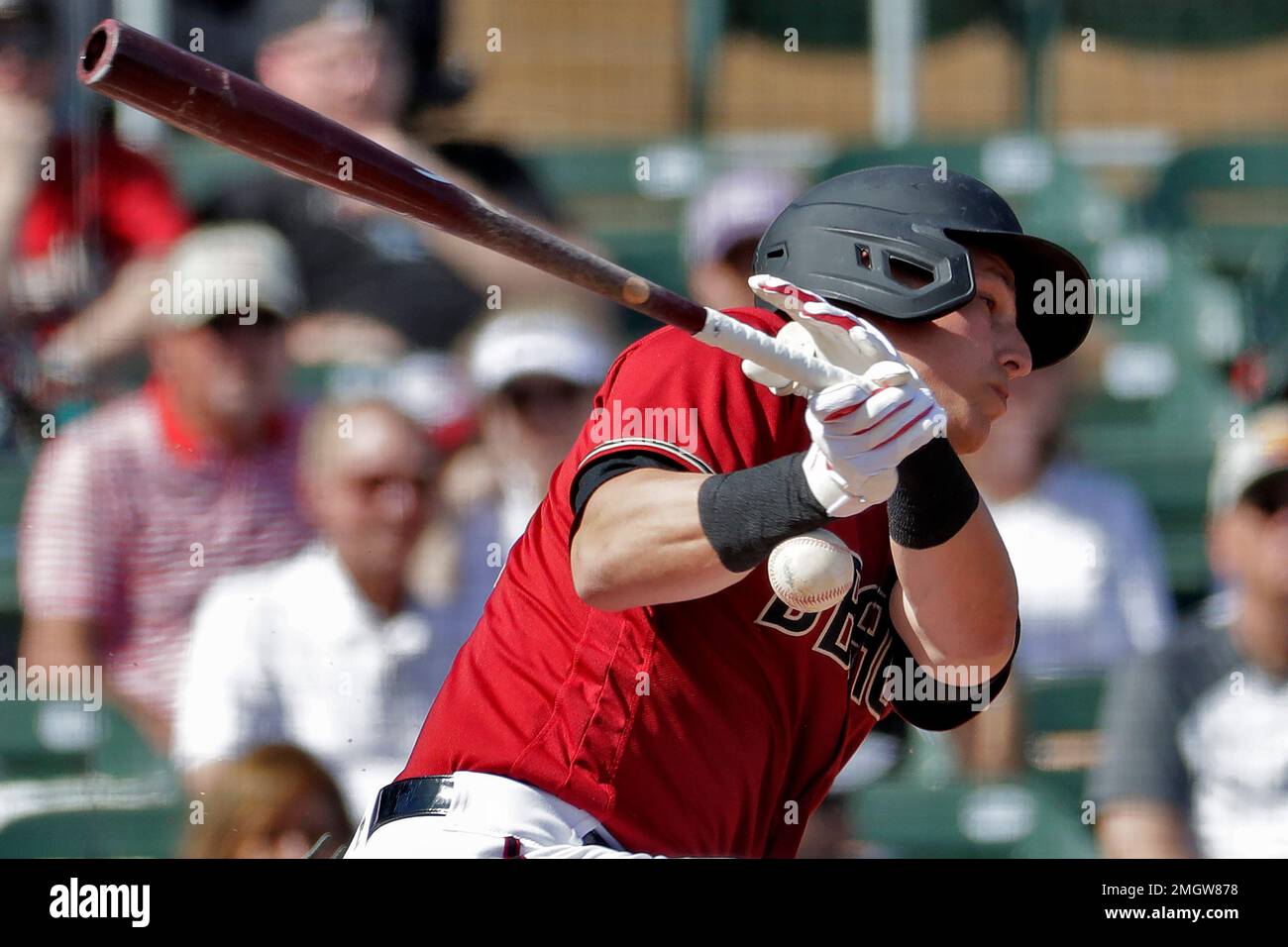 Arizona Diamondbacks' Jake Lamb fouls a ball off his wrist during the ...