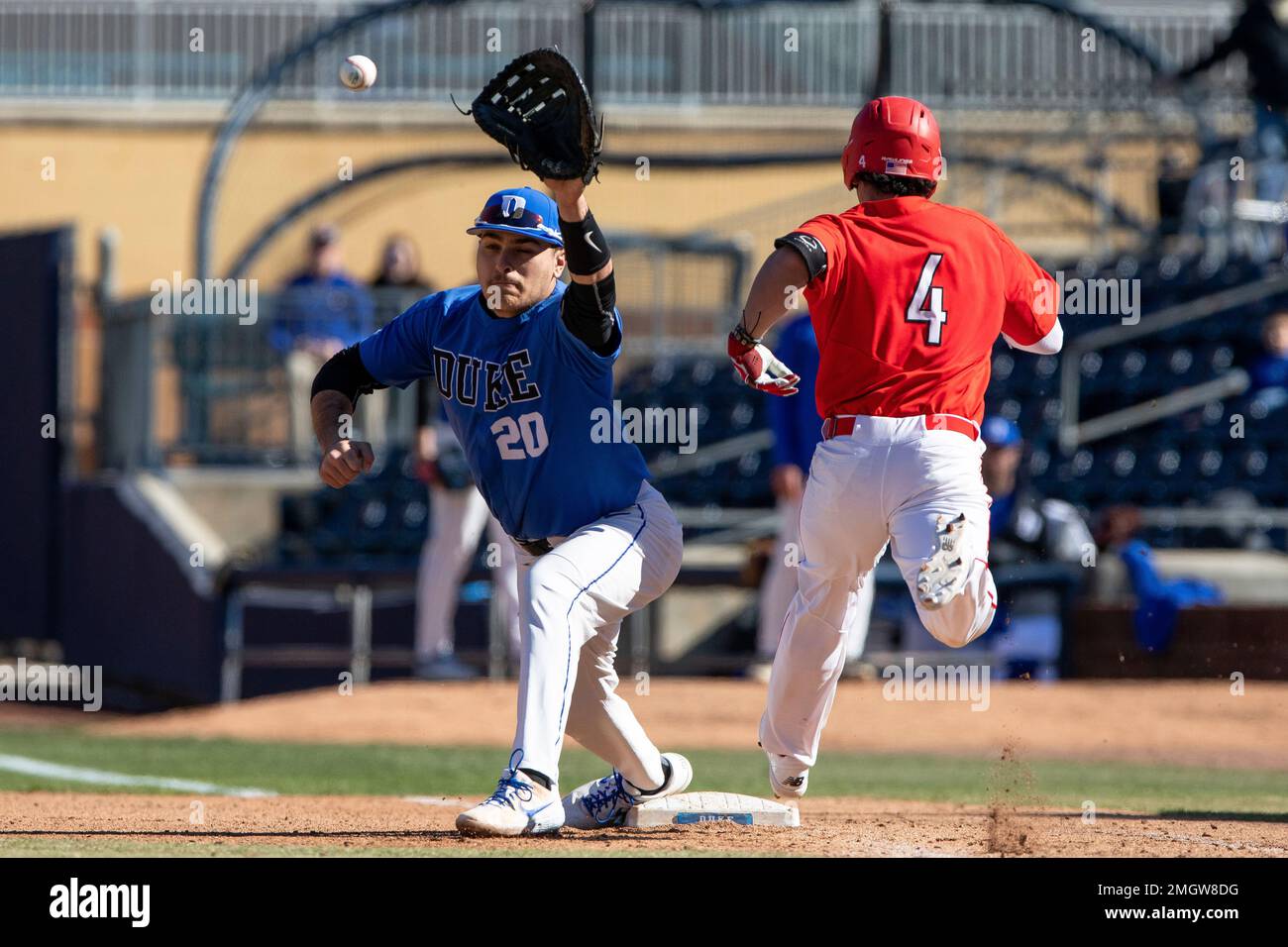 Duke's Matt Mervis (20) completes the force-out of Cornell's Kalani ...