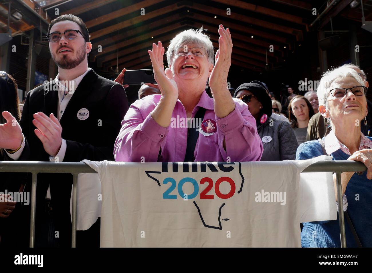 Bloomberg supporter Gail Norris, center, applauds as Democratic ...