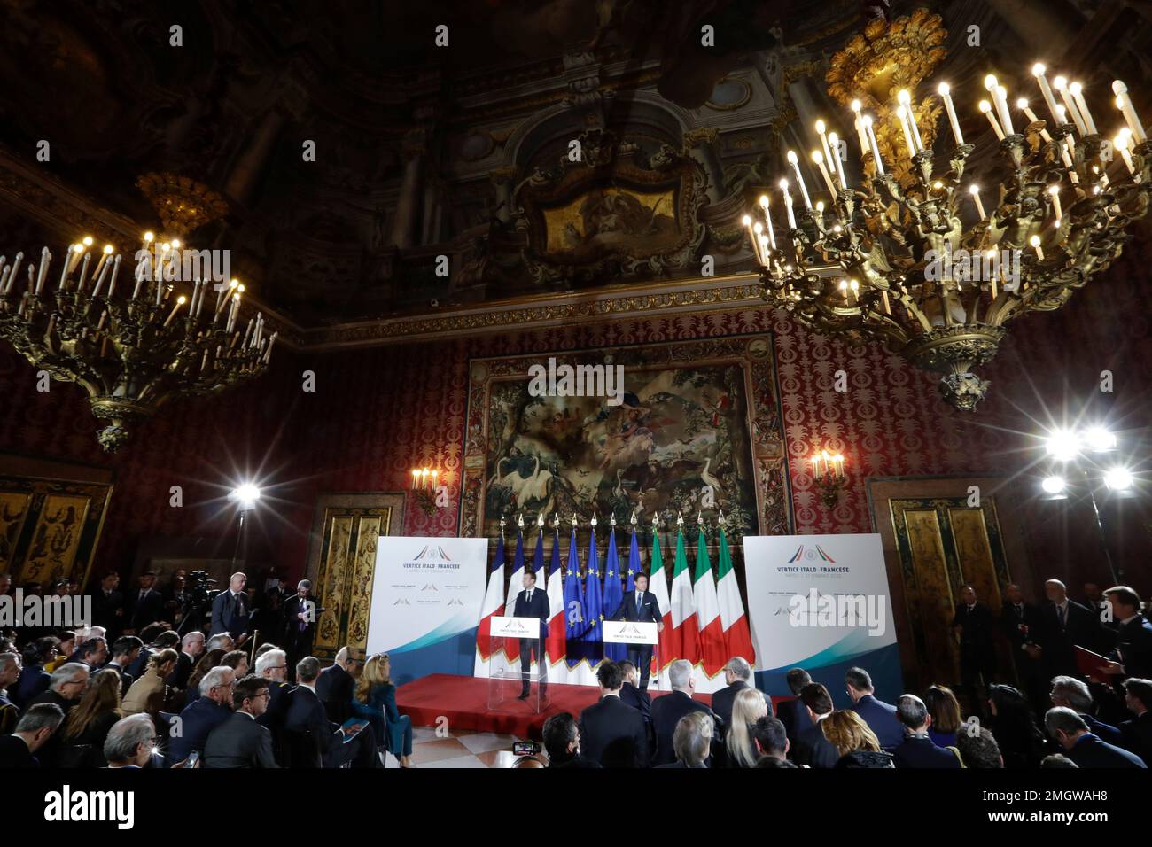 Italian Premier Giuseppe Conte, right, and French President Emmanuel ...