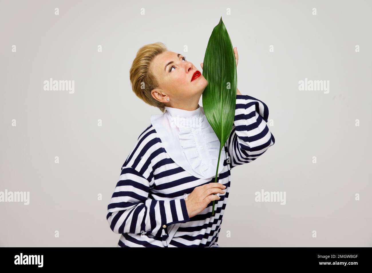 Portrait of fashionable middle age blonde woman with short haircut in ...