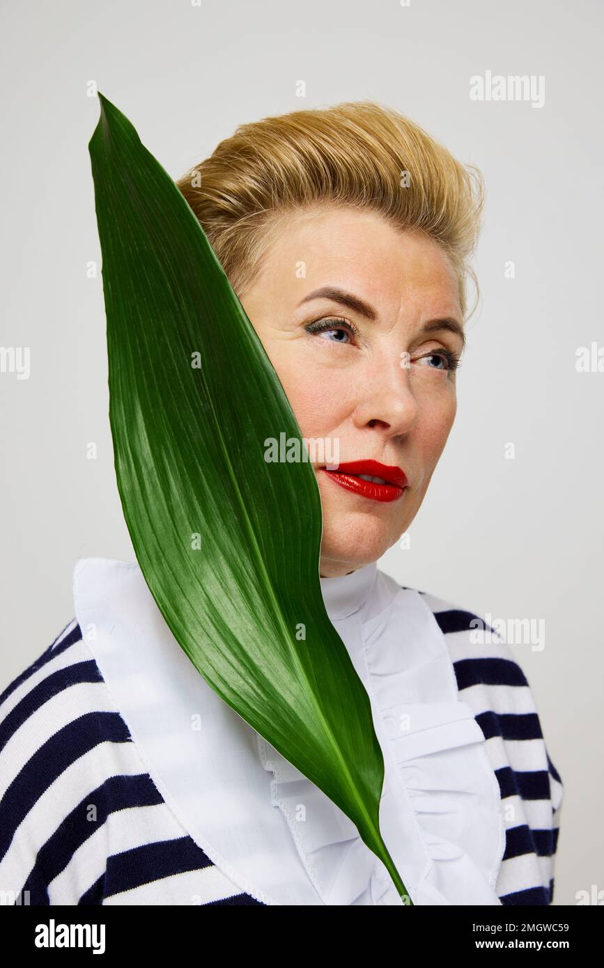 Portrait of fashionable middle age blonde woman with short haircut in ...