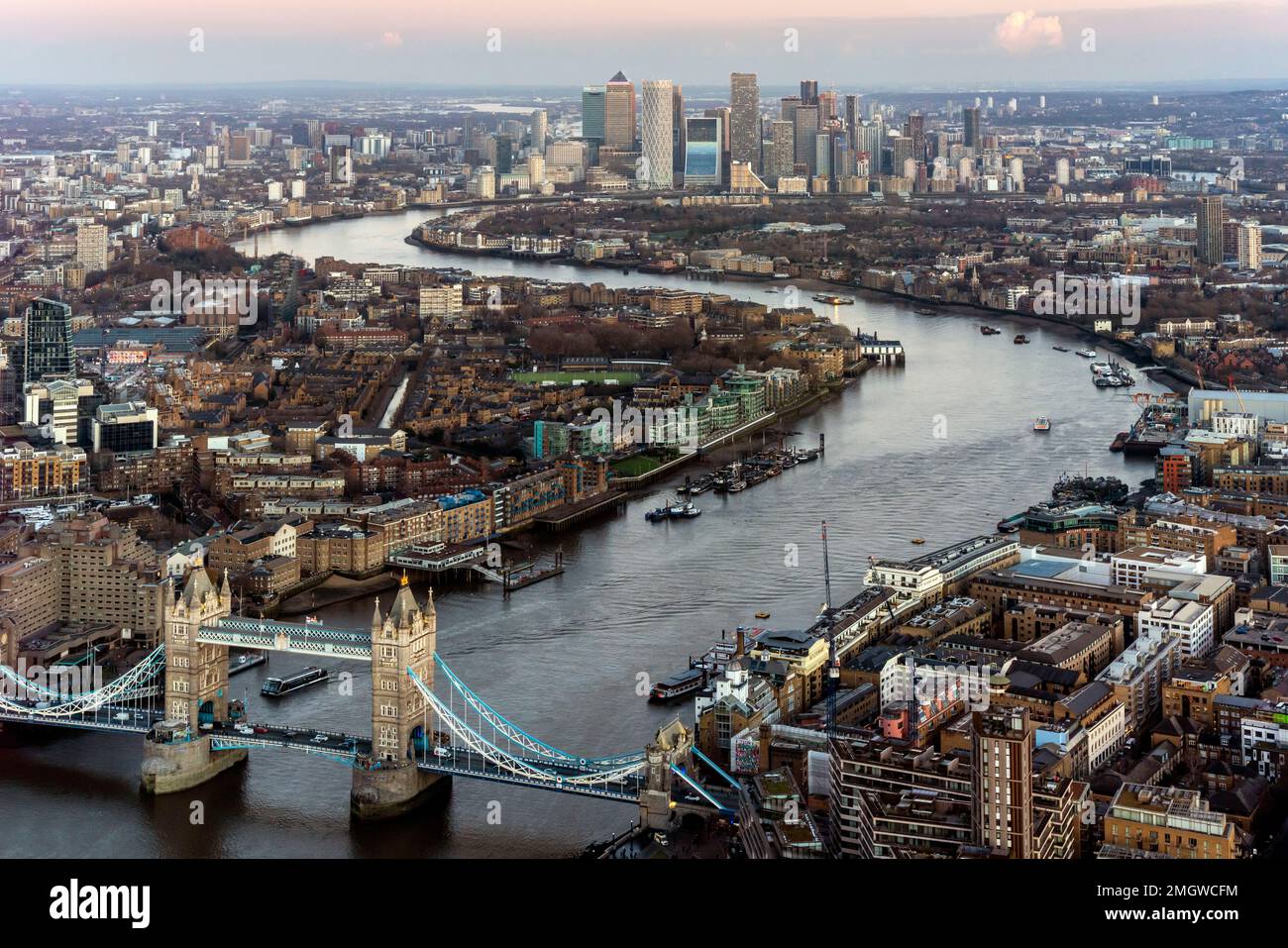 A View Of Tower Bridge, The River Thames and Canary Wharf at Sunset ...