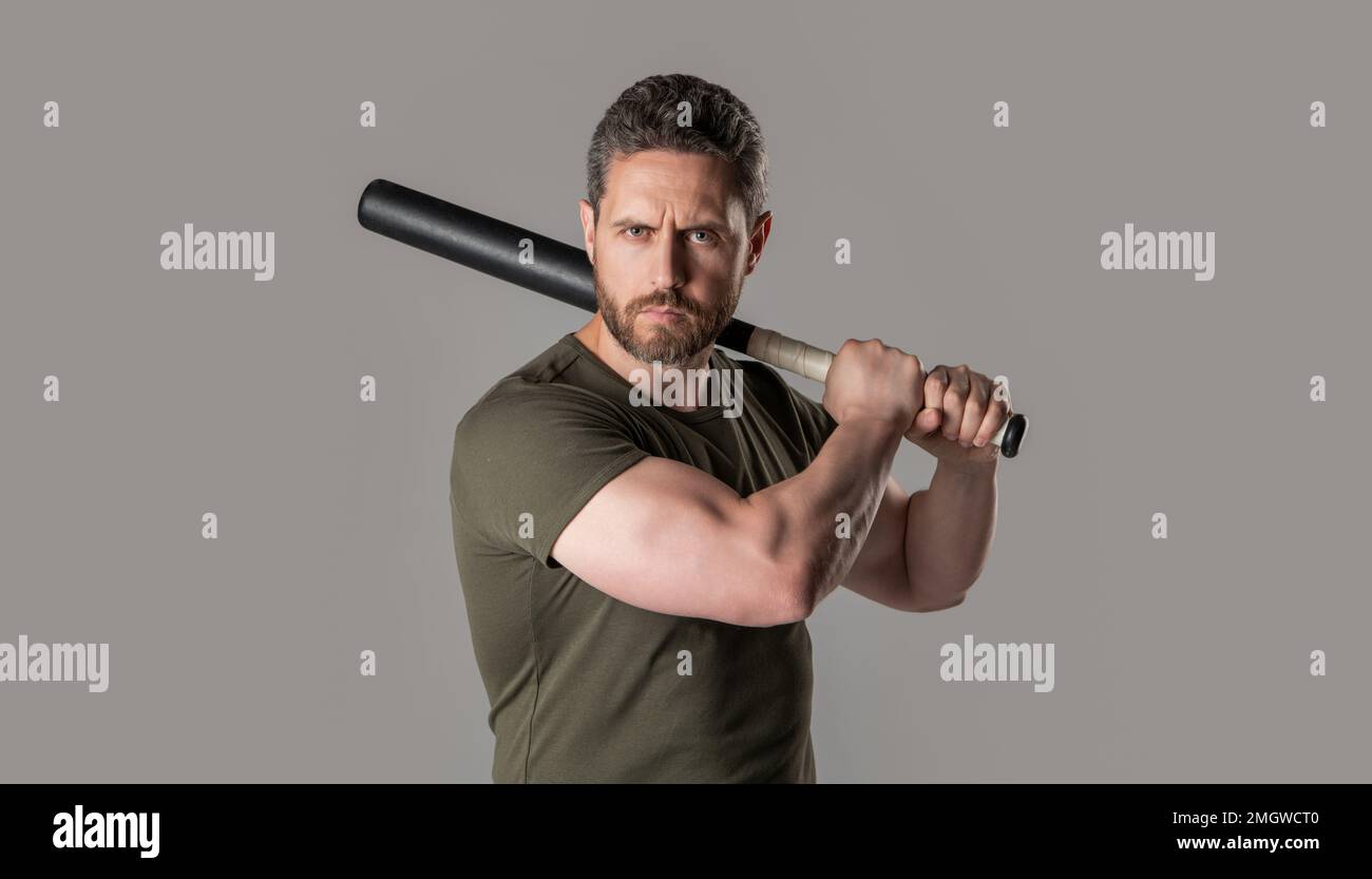 angry man express anger beating with bat isolated on grey background ...