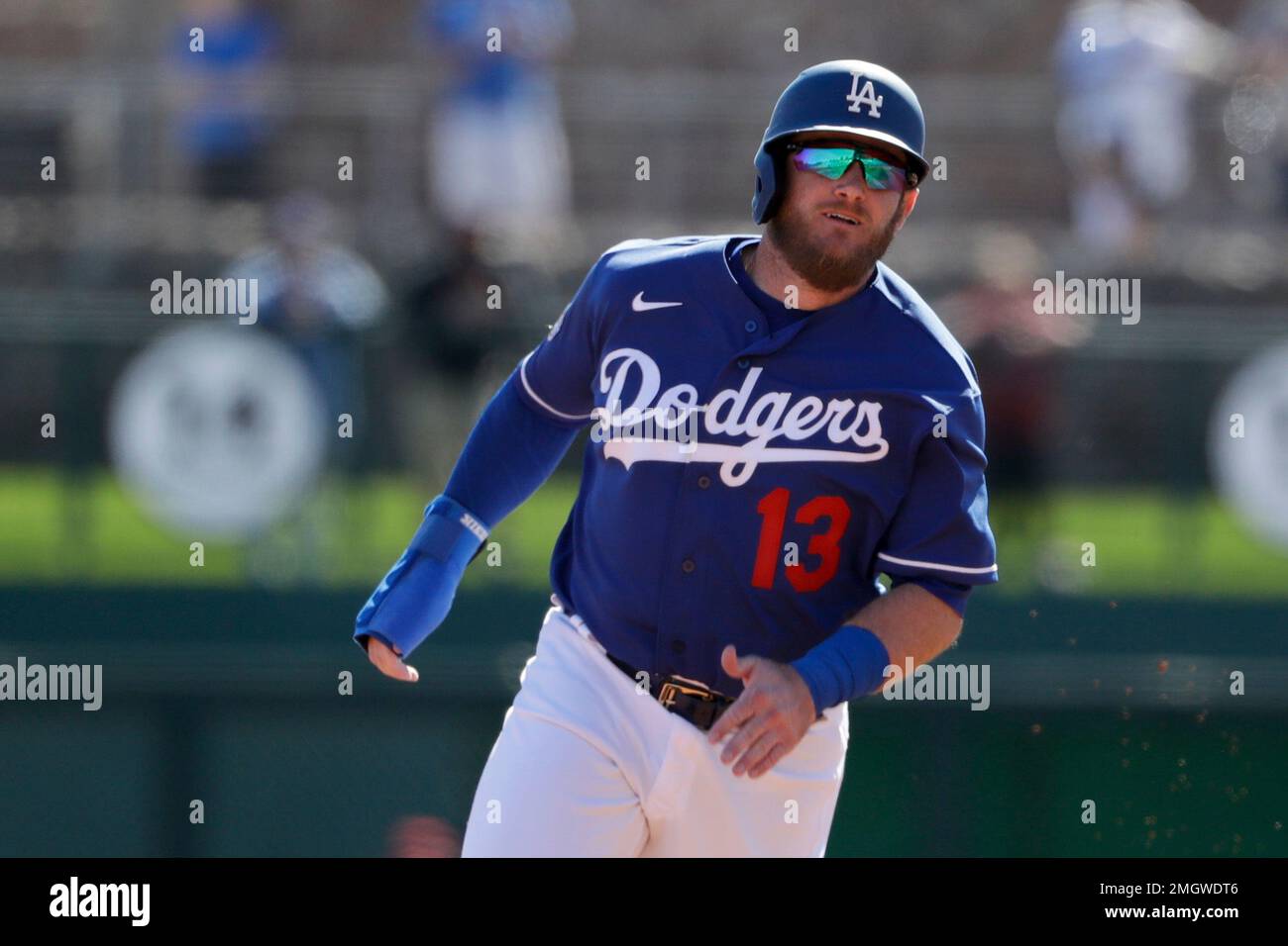 Los Angeles Dodgers' Max Muncy runs during the third inning of a spring ...