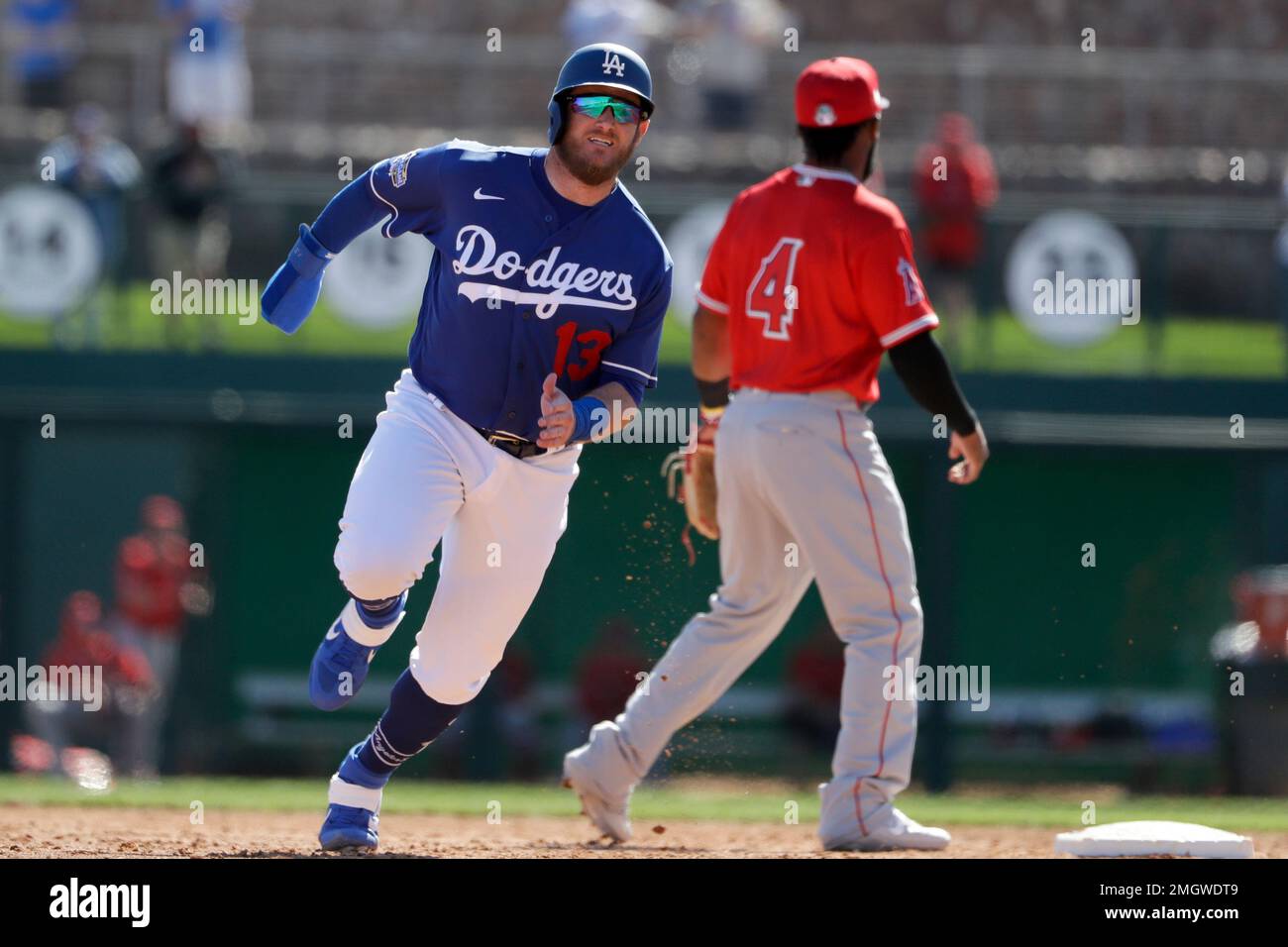 Los Angeles Dodgers' Max Muncy runs during the third inning of a spring ...