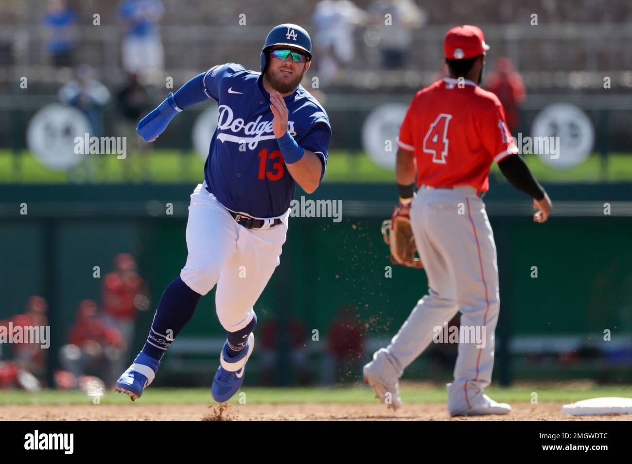 Los Angeles Dodgers' Max Muncy runs during the third inning of a spring ...