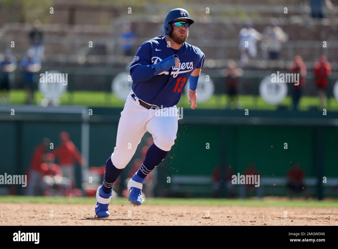 Los Angeles Dodgers' Max Muncy runs during the third inning of a spring ...