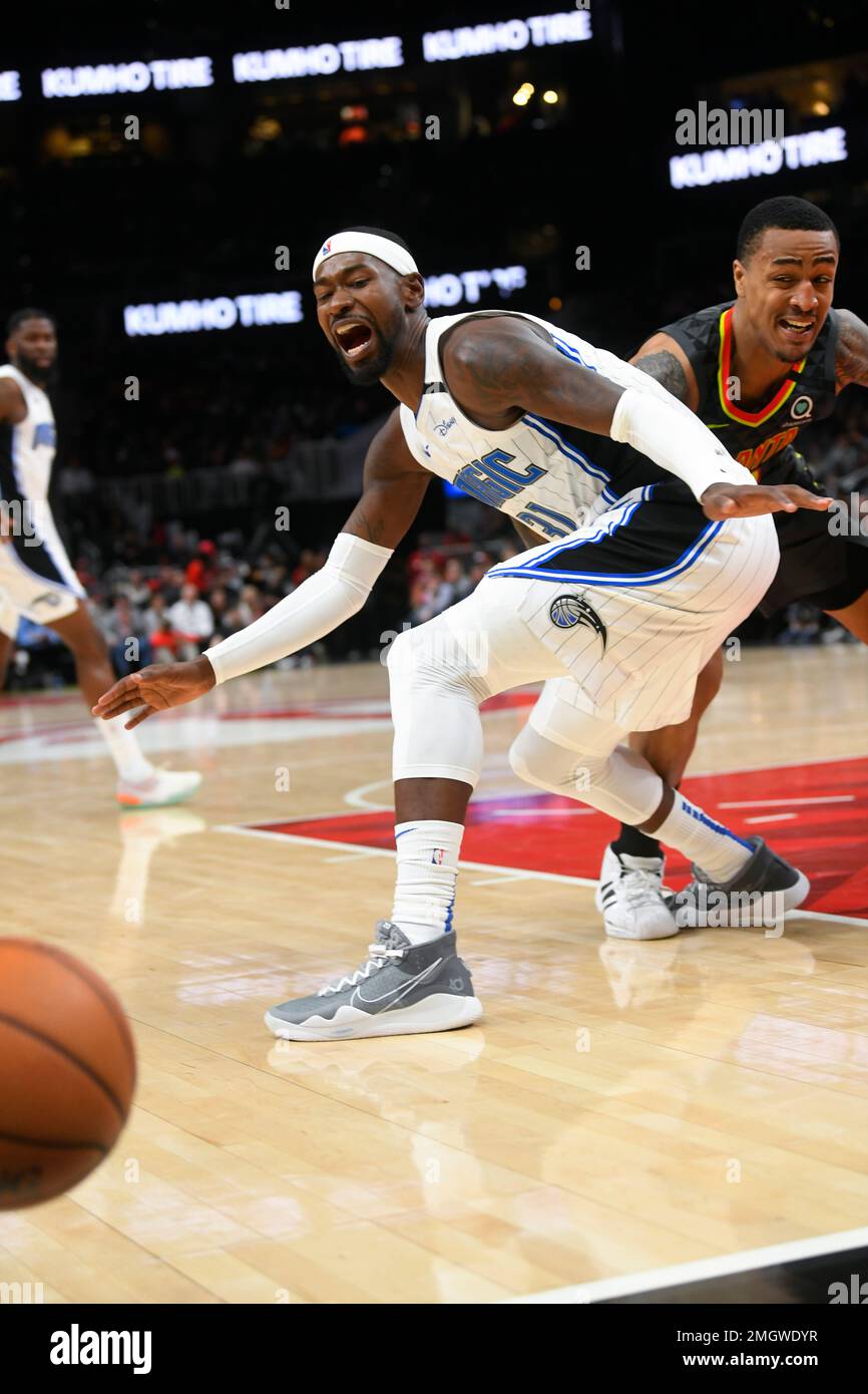 Orlando Magic guard Terrence Ross (31) and Atlanta Hawks forward John ...