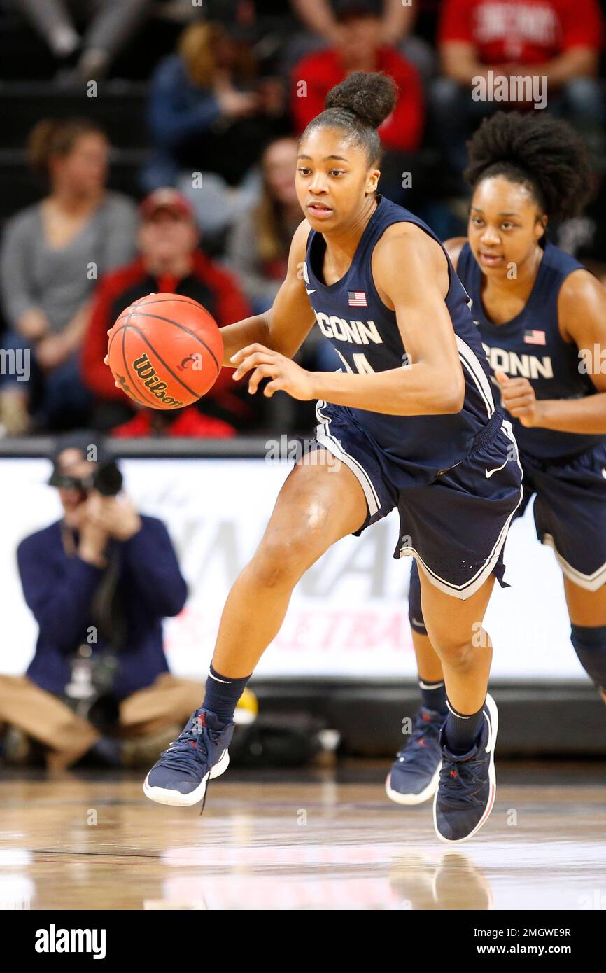 Connecticut guard Aubrey Griffin, front drives the ball against ...