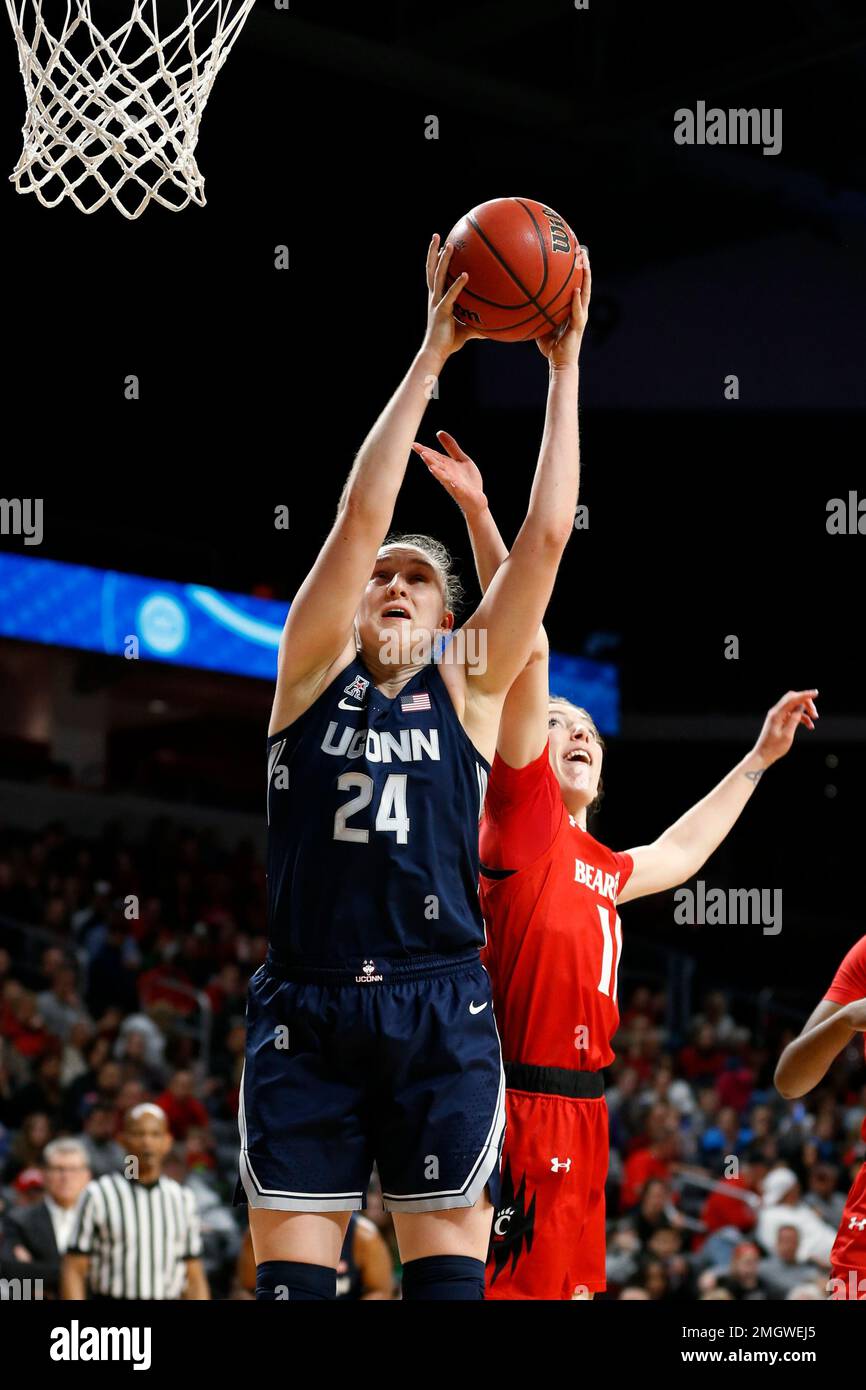 Connecticut guard Anna Makurat (24) grabs a rebound in front of ...