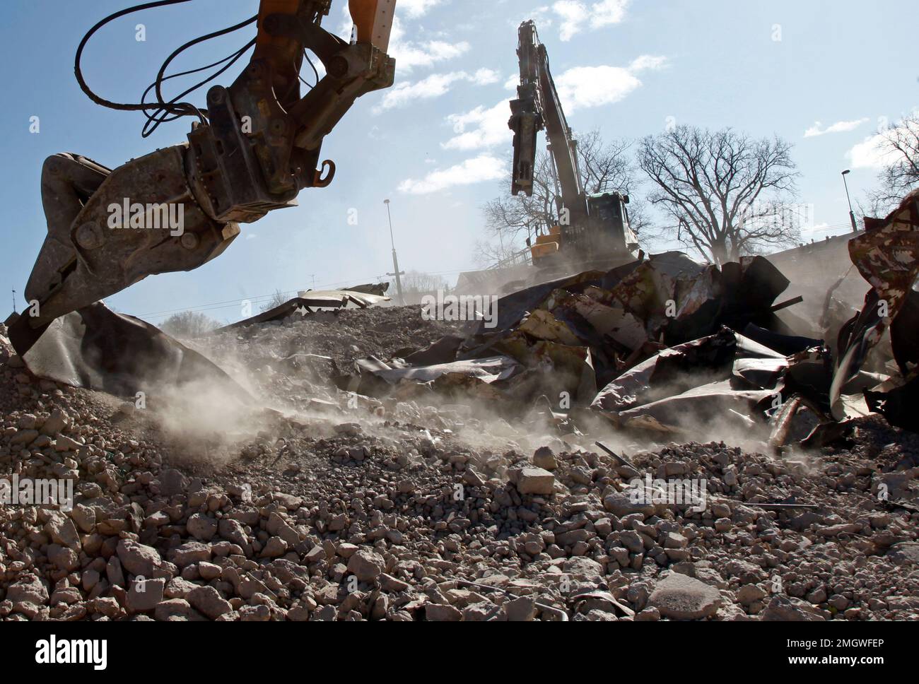 Excavators demolishing a building Stock Photo - Alamy