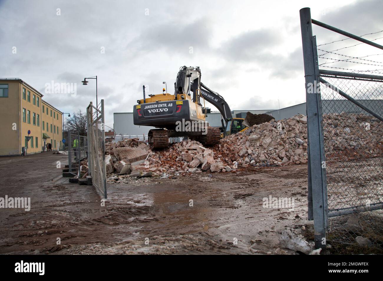 Excavators demolishing a building Stock Photo - Alamy