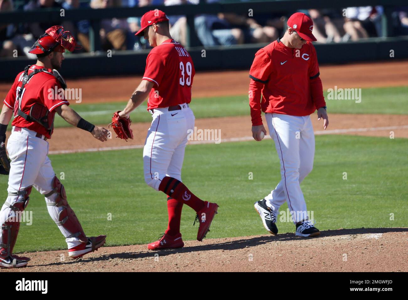 Cincinnati Reds manager David Bell, right, replaces Reds pitcher Lucas ...