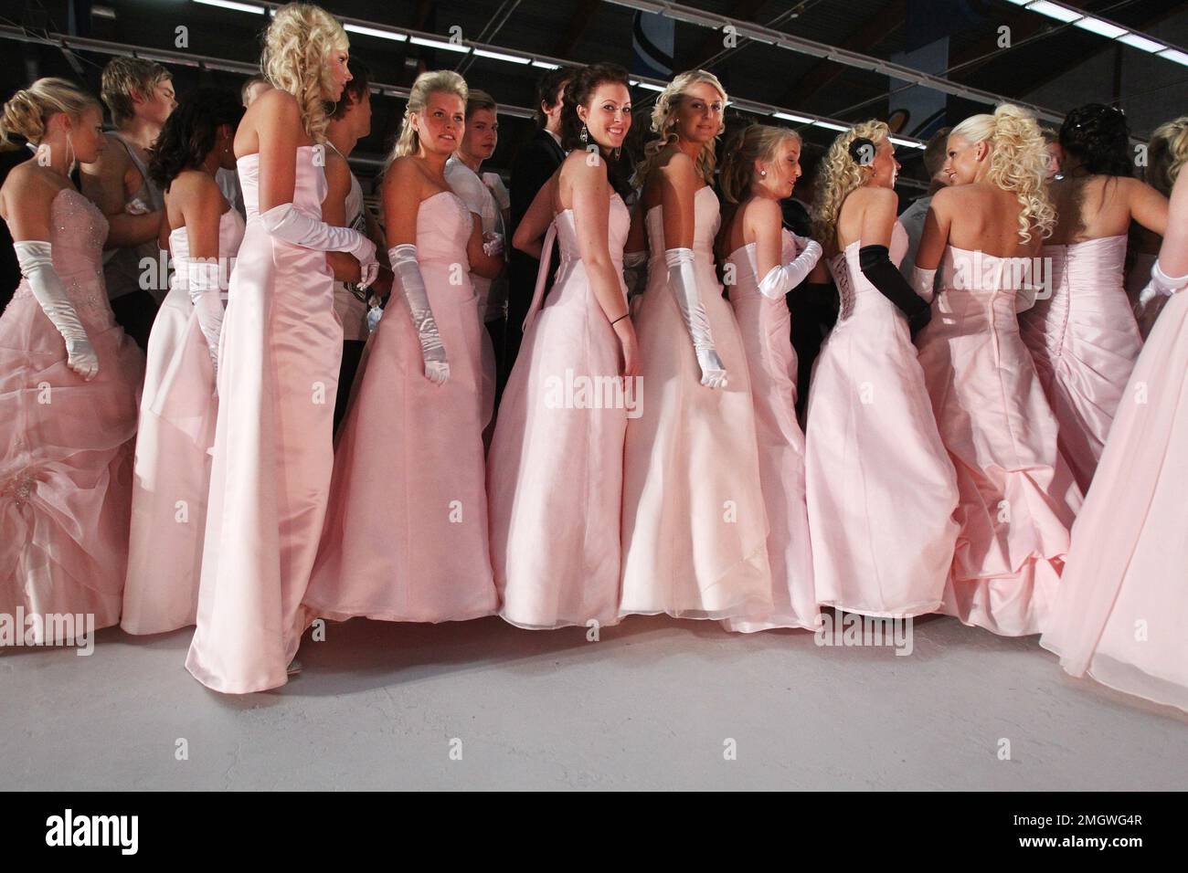 Preparations for young people from a school just before a prom/ball ...