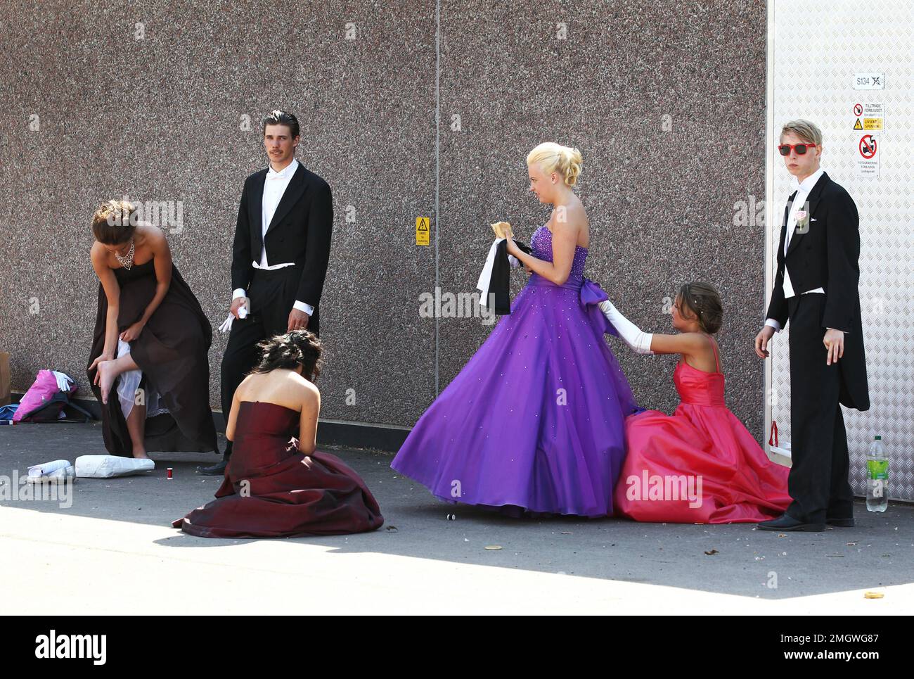 Preparations for young people from a school just before a prom/ball ...