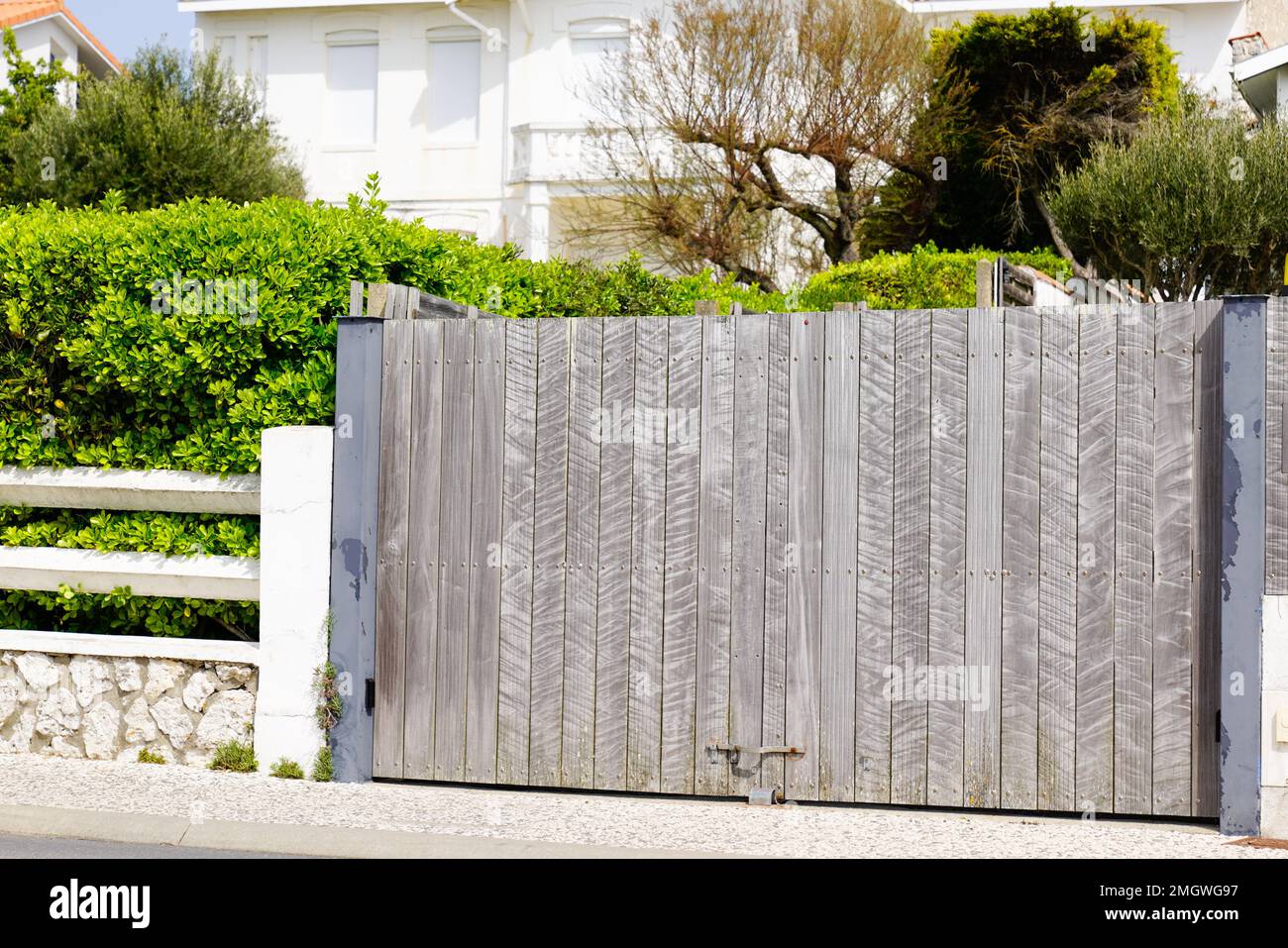 wooden gate high closed of private house suburb wood portal home door ...