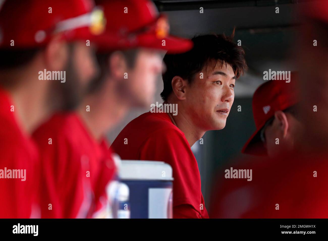 St. Louis Cardinals pitcher Kwang-Hyun Kim sits in the dugout before ...