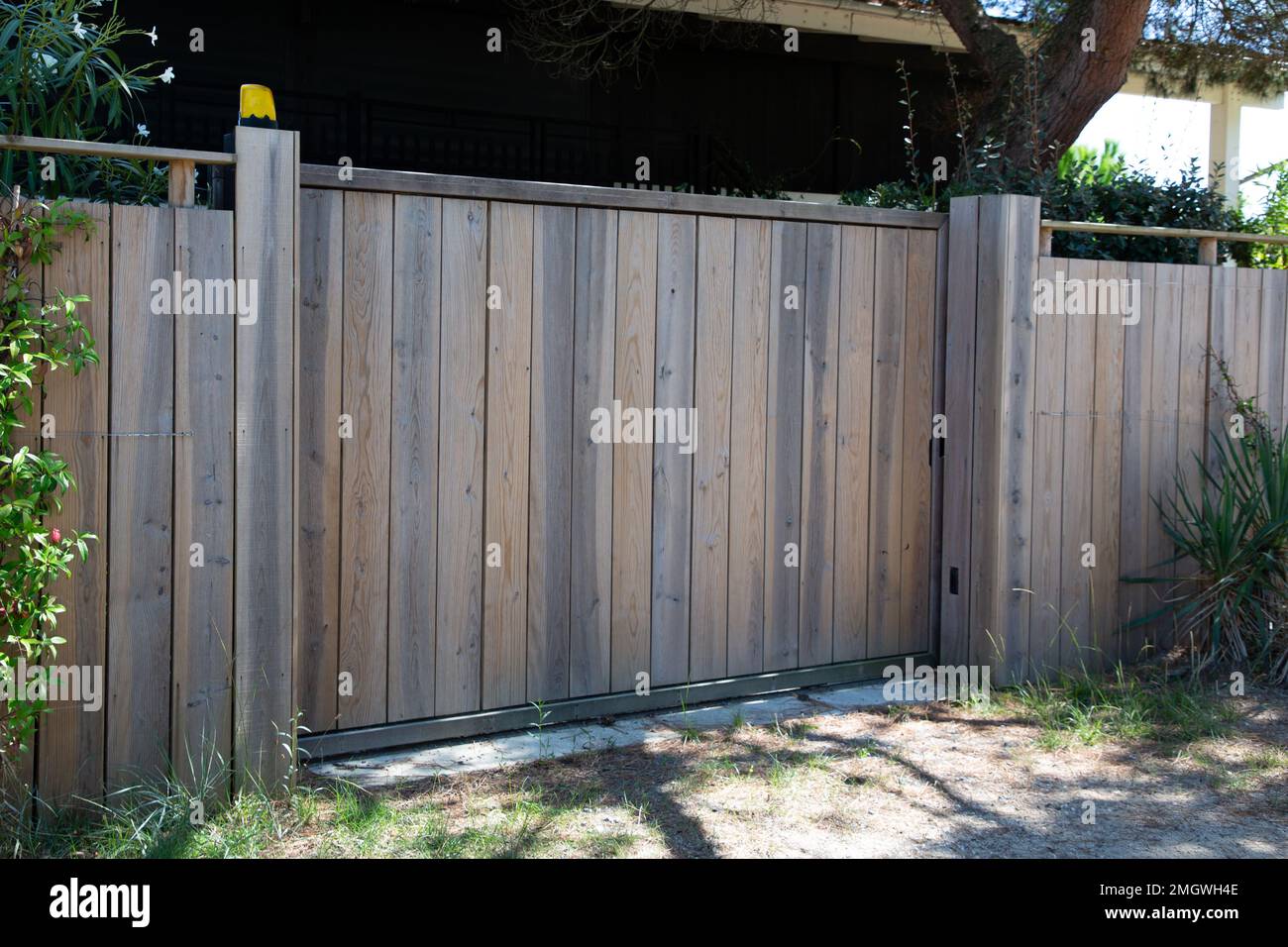 Brown entry wooden gate closed of modern luxe house modern classic wood ...