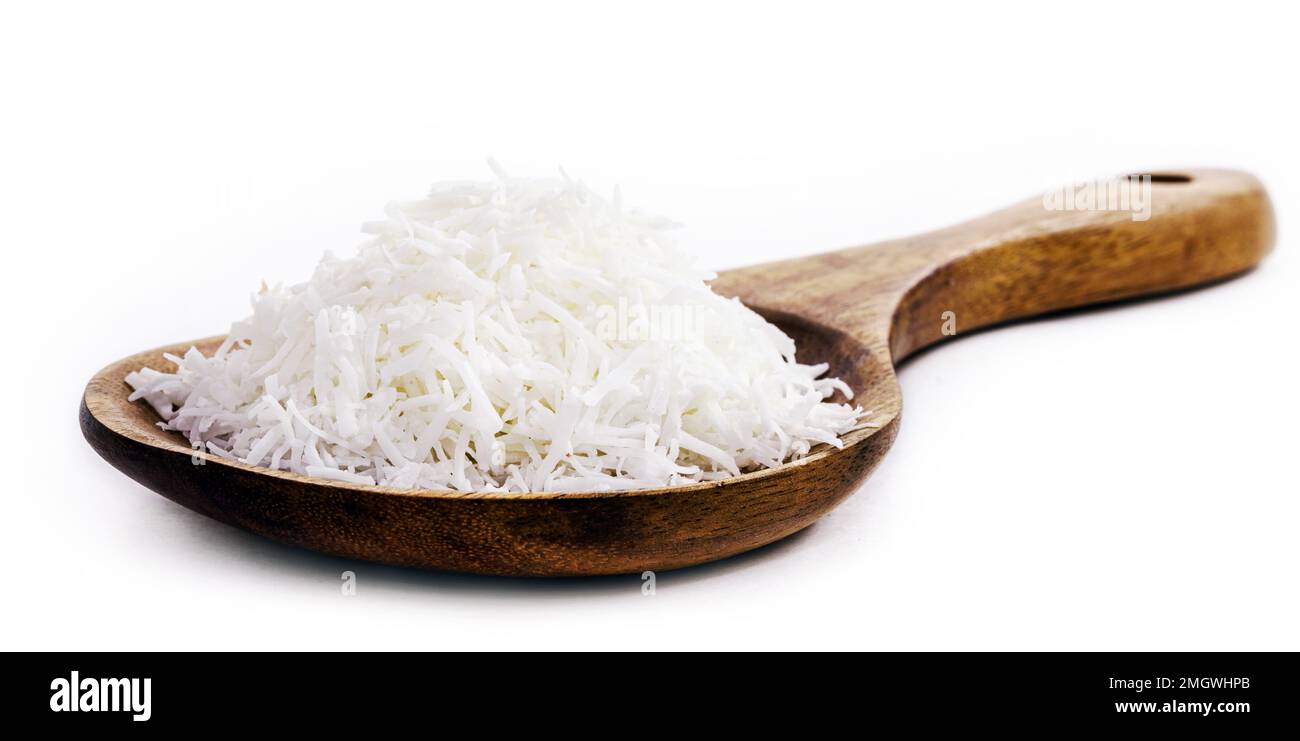 wooden spoon rustic with grated coconut on white background with copy ...